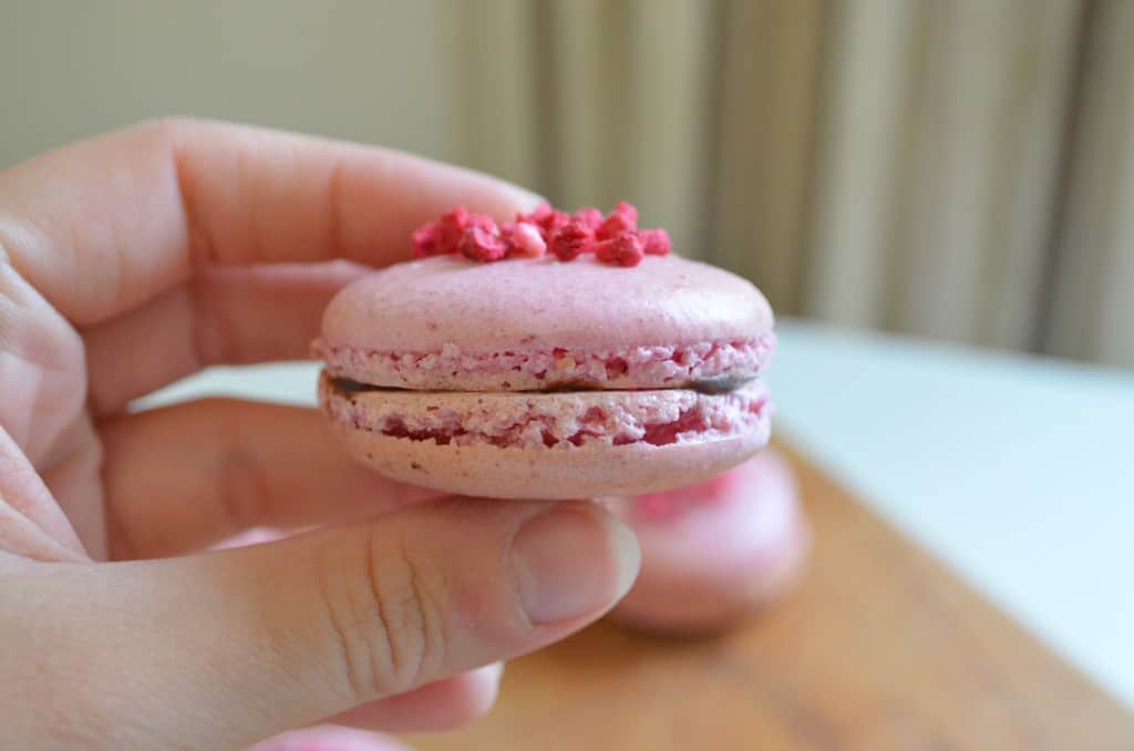 Raspberry Macarons with Chocolate Ganache - Baking with Aimee.