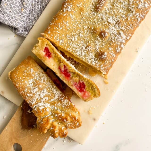 Pistachio, Raspberry and Crème Patissiere Tart - Baking with Aimee.